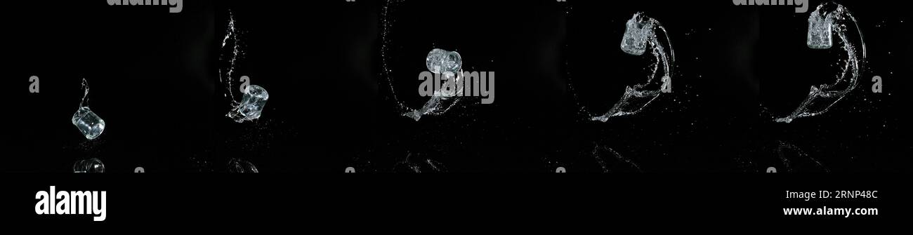 Glass of Water Bouncing and Splashing on Black Background Stock Photo ...