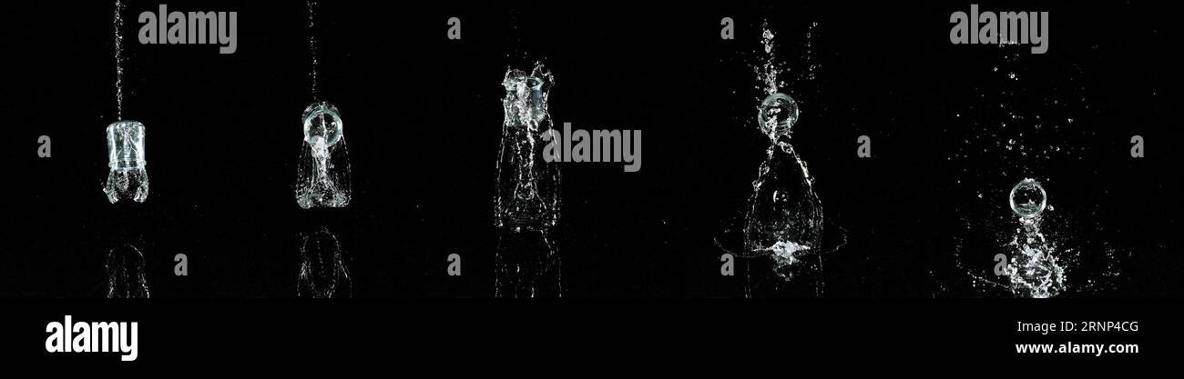 Glass of Water Bouncing and Splashing on Black Background Stock Photo ...