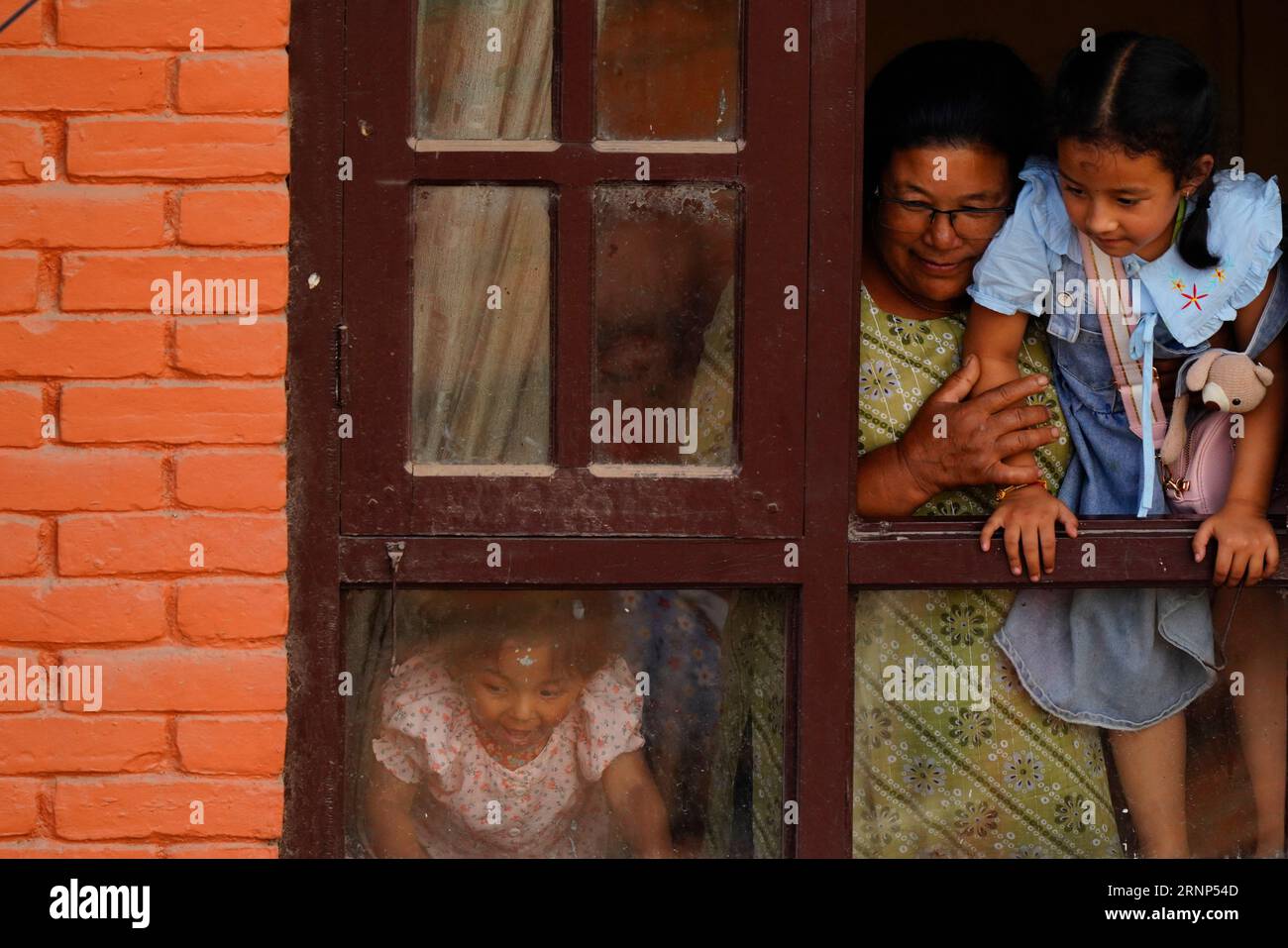 Lalitpur, Nepal. 2nd Sep, 2023. Locals watch as Nepalese revelers ...