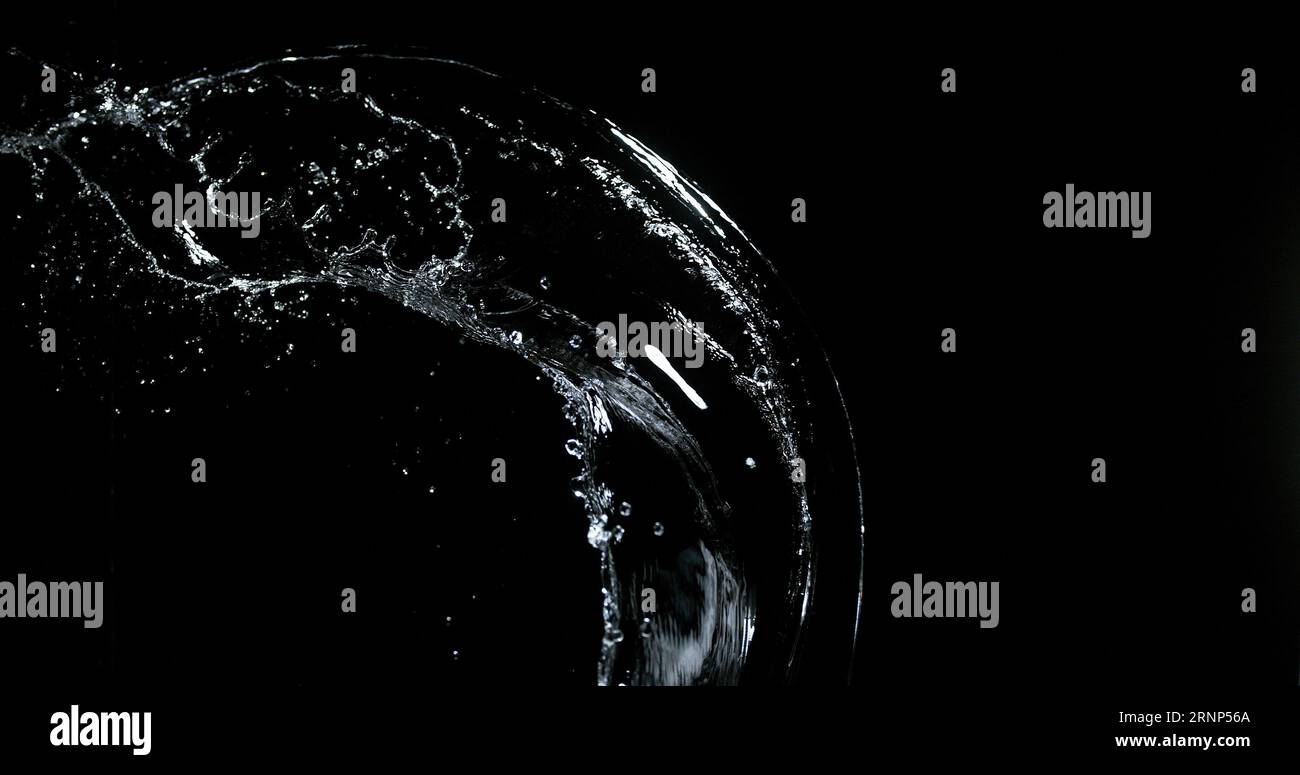 Water spurting out ans Splashing against Black Background Stock Photo ...