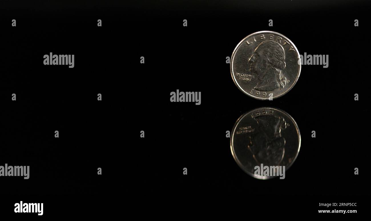 Quarter Dollar Coins Falling, Rolling and Sliding on Black Background ...