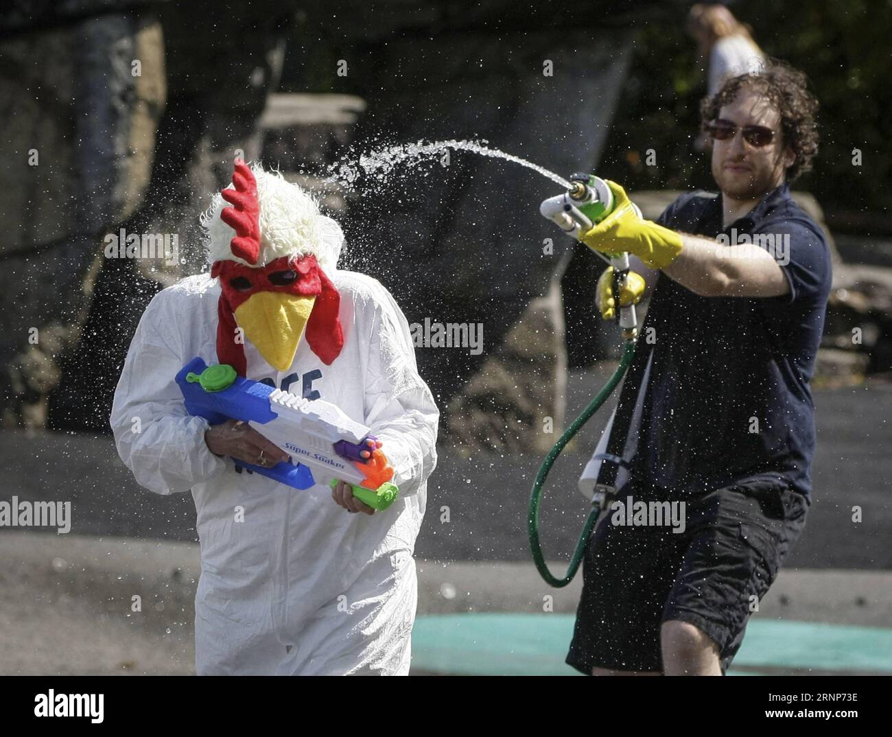 (170814) -- VANCOUVER, Aug. 14, 2017 -- People enjoy the splash of ...