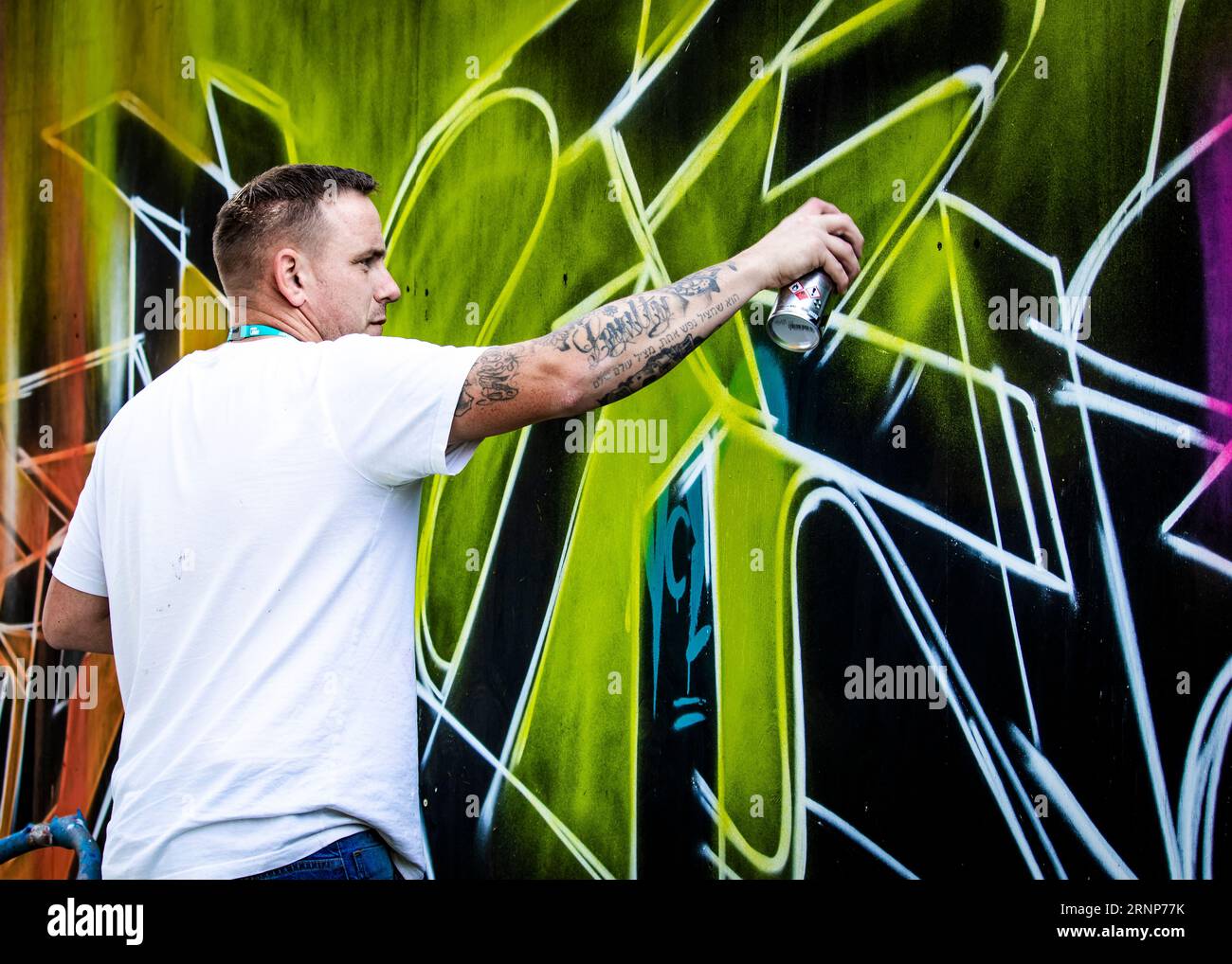 Graffiti artists creating street art pieces at the at the Southend City ...