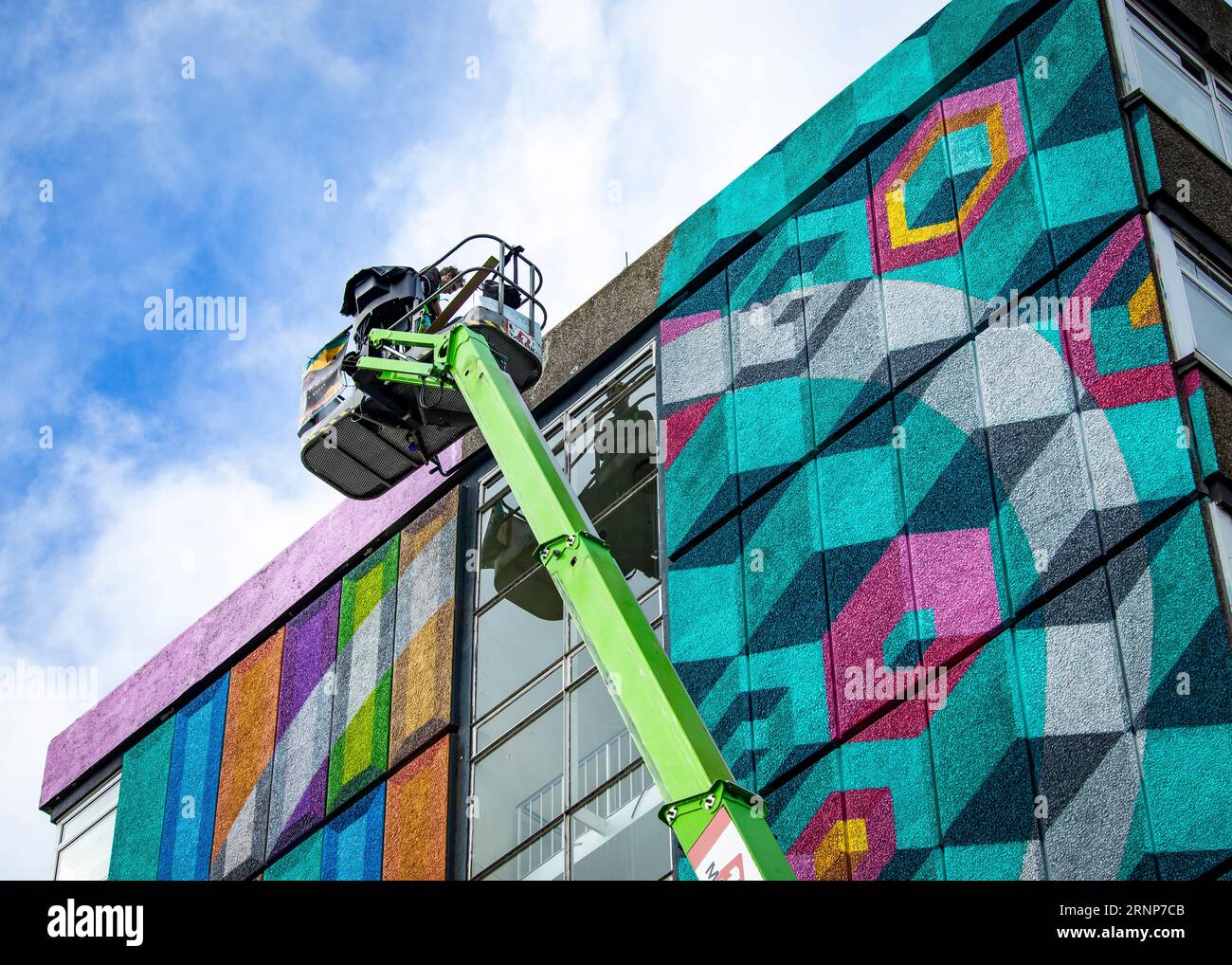 Graffiti artists creating street art pieces at the at the Southend City ...