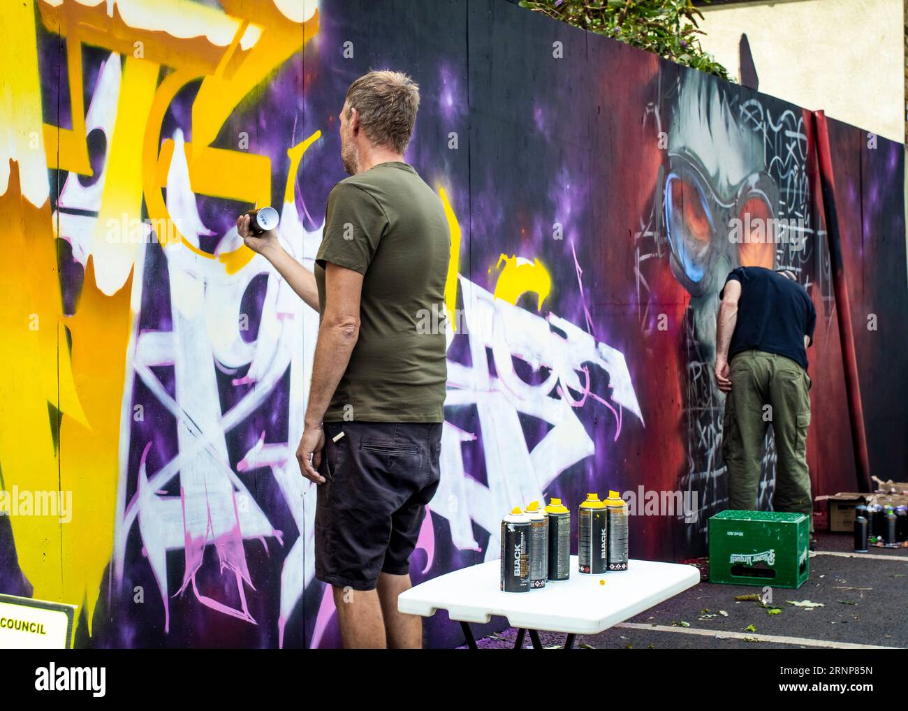 Graffiti artists creating street art pieces at the at the Southend City ...