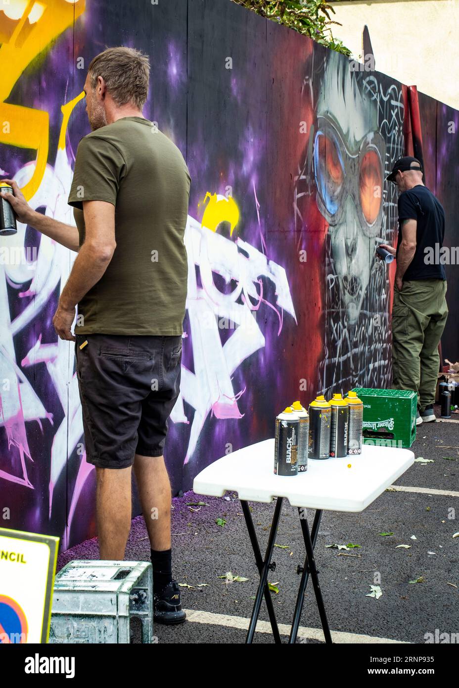 Graffiti artists creating street art pieces at the at the Southend City ...