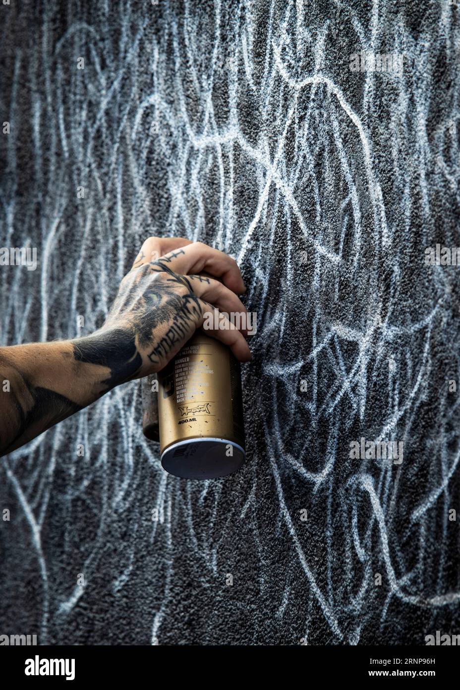 Graffiti artists creating street art pieces at the at the Southend City ...