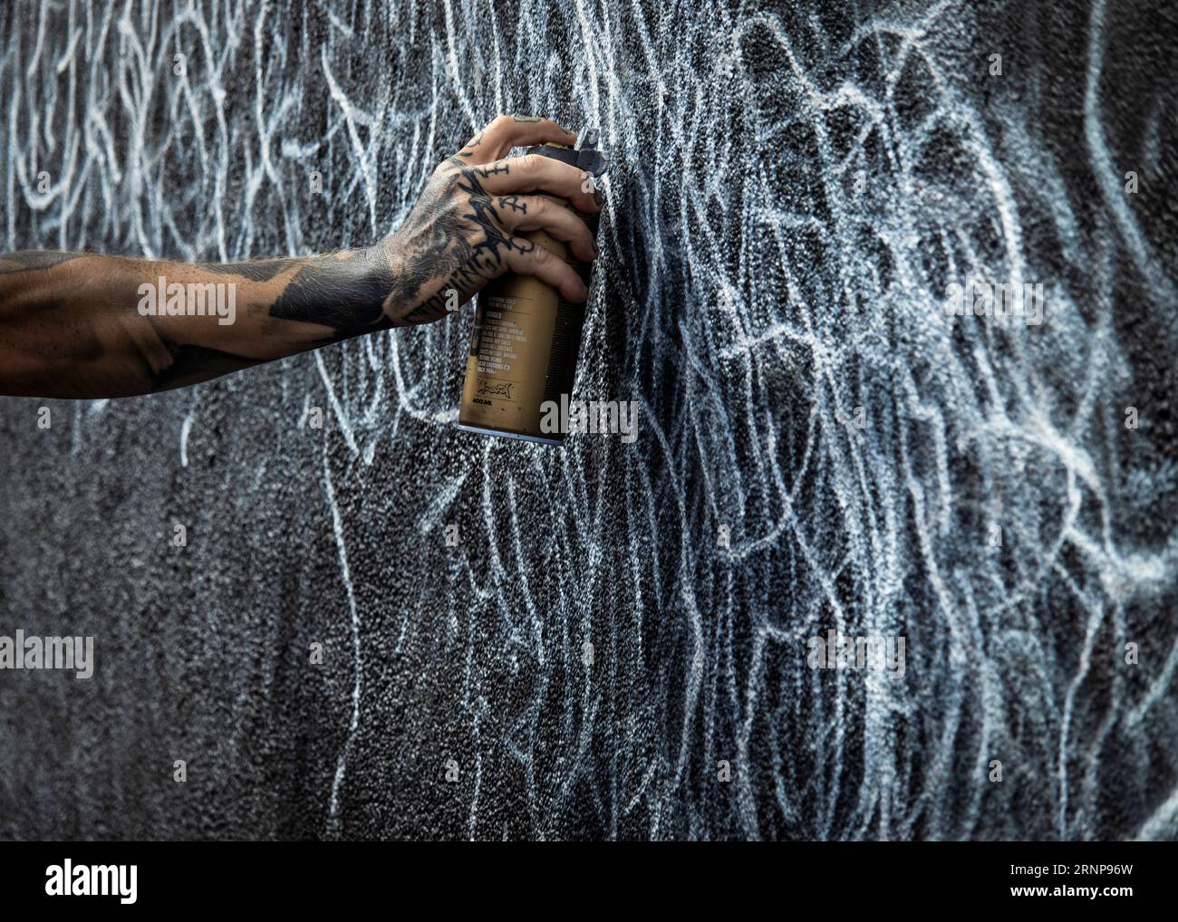 Graffiti artists creating street art pieces at the at the Southend City ...