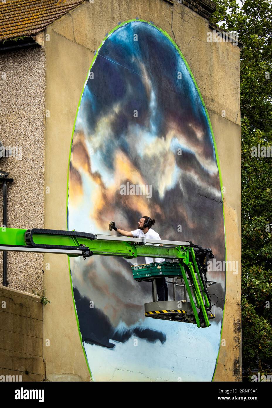 Graffiti artists creating street art pieces at the at the Southend City ...