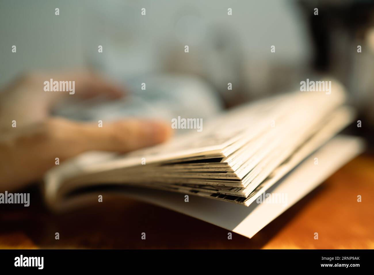 Reading Manga, a Japanese comic book Stock Photo - Alamy