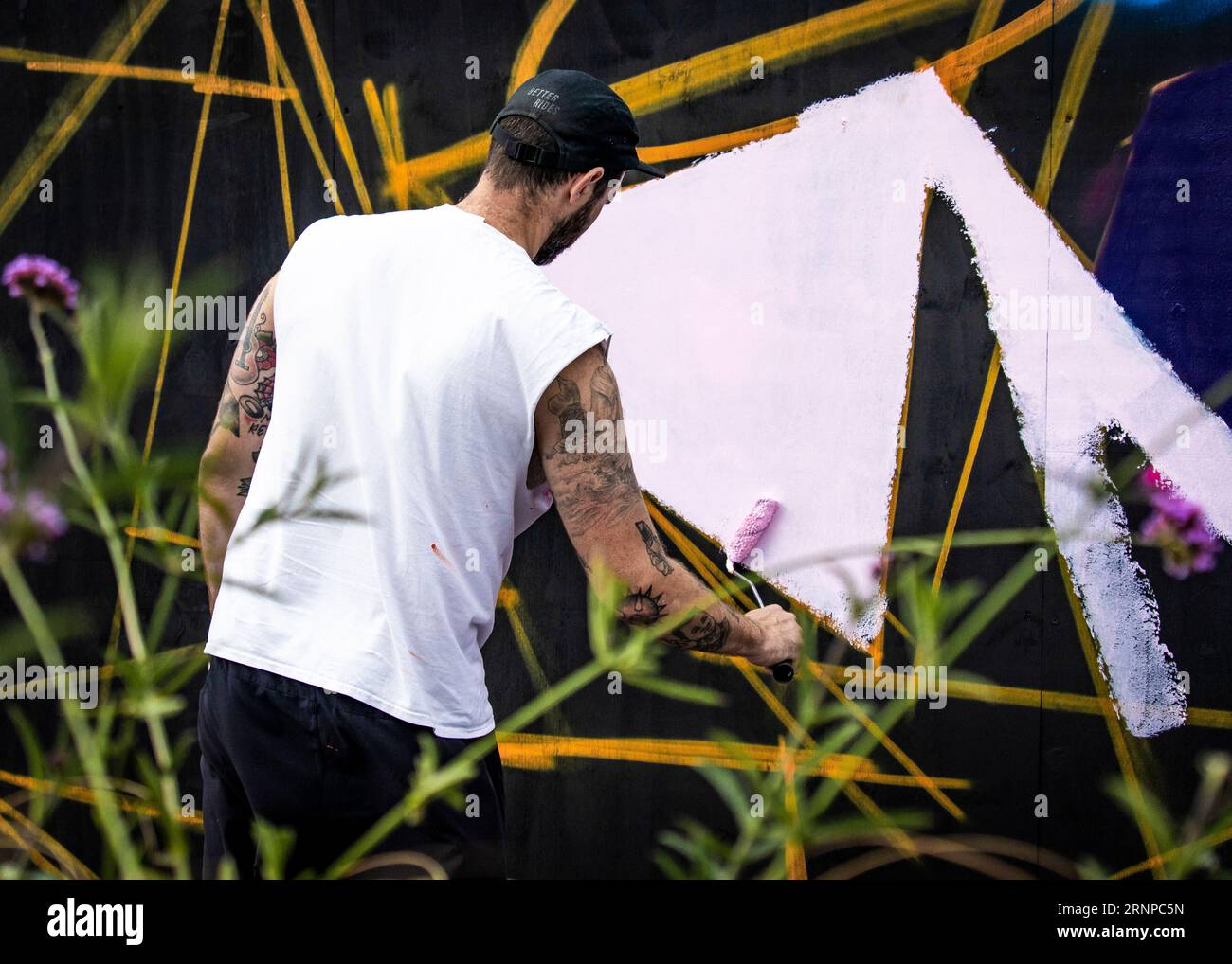 Graffiti artists creating street art pieces at the at the Southend City ...