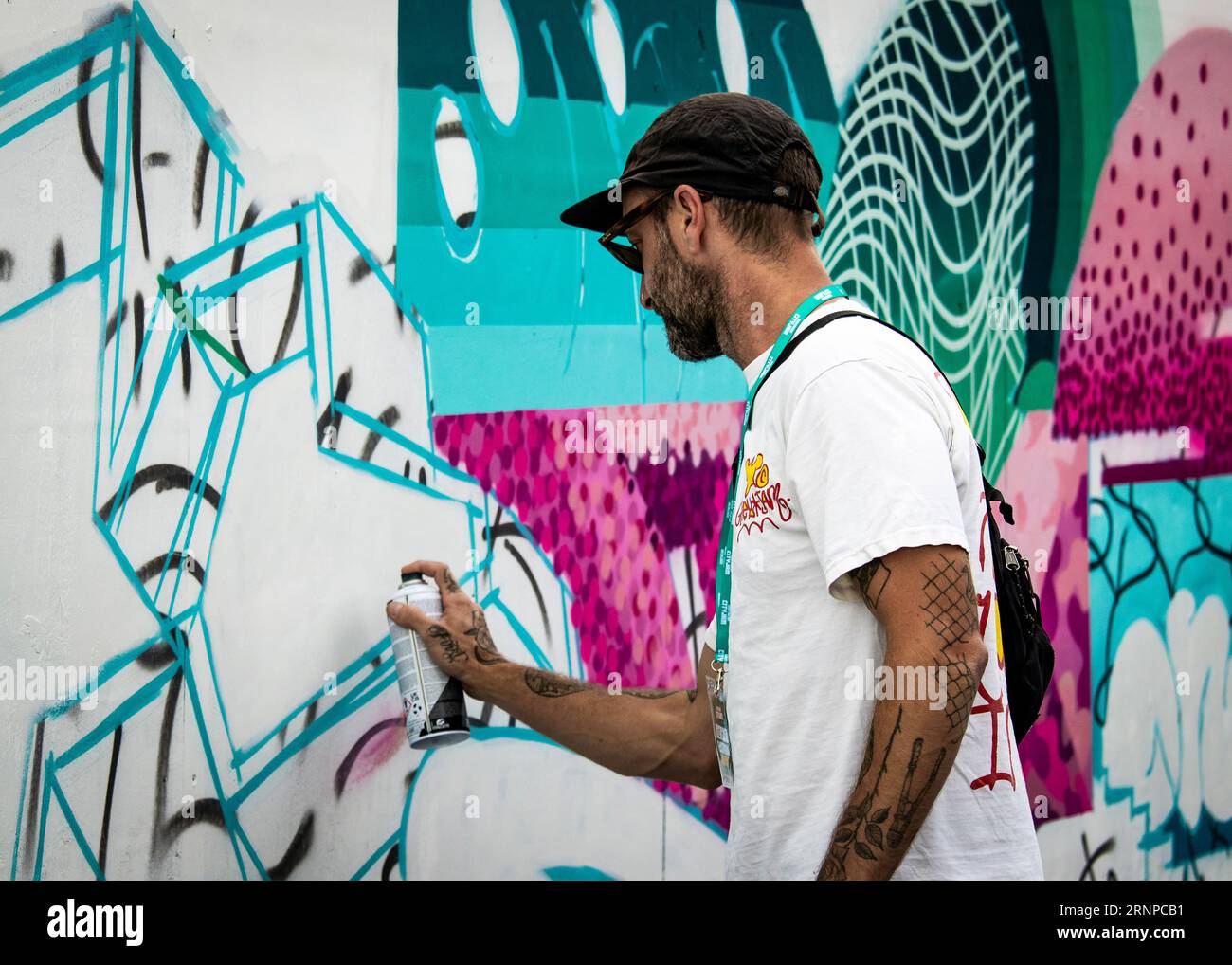 Graffiti artists creating street art pieces at the at the Southend City ...