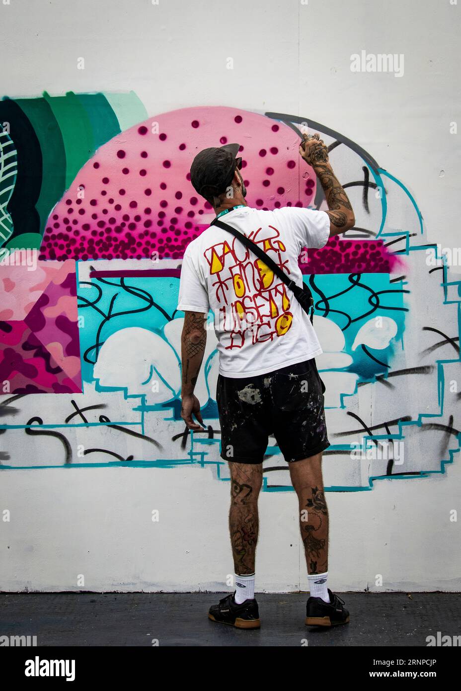 Graffiti artists creating street art pieces at the at the Southend City ...