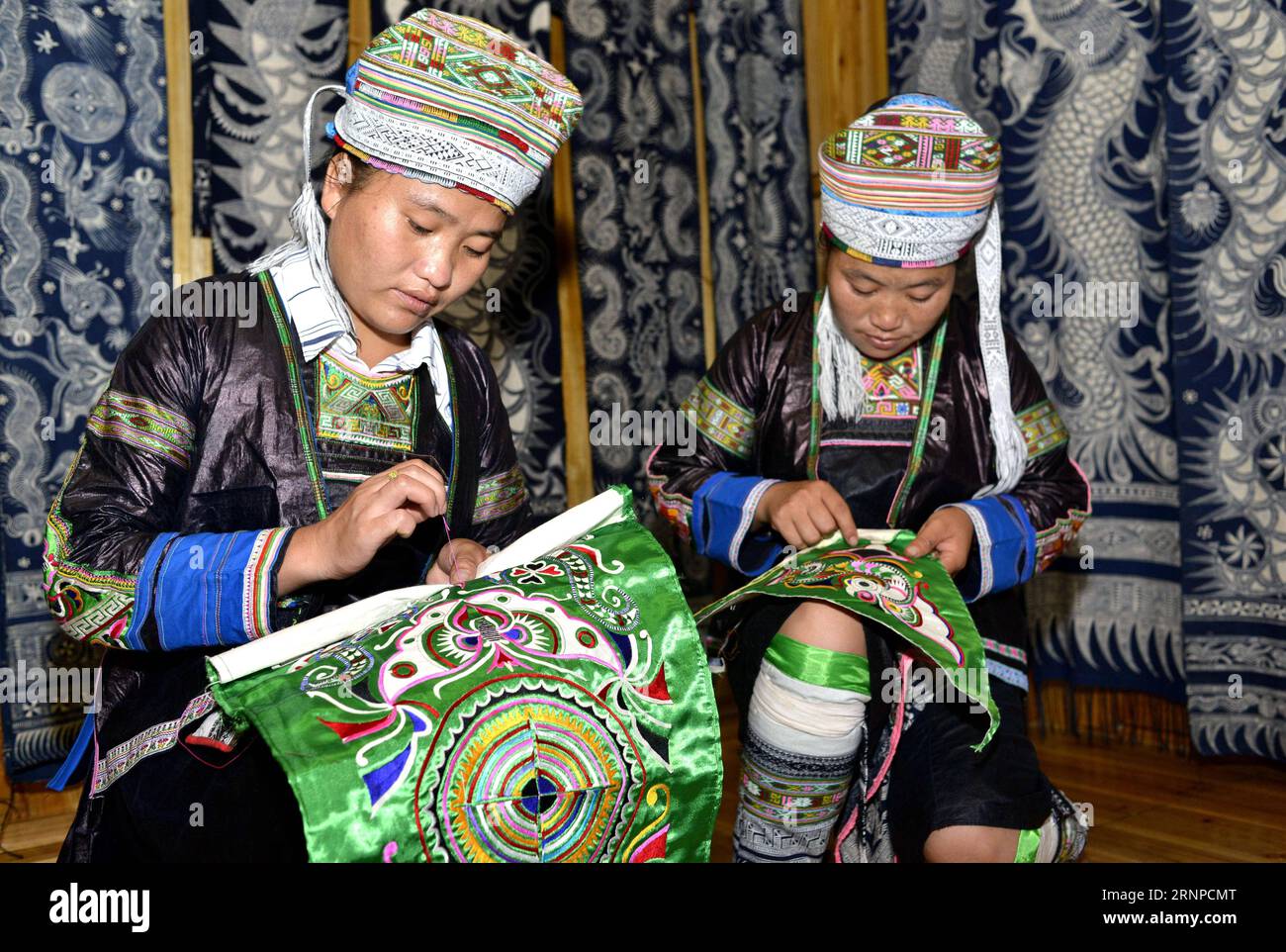Women in traditional costume miao people hi-res stock photography and ...