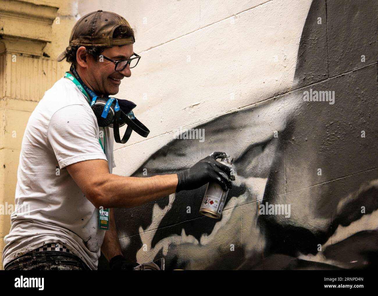 Graffiti artists creating street art pieces at the at the Southend City ...