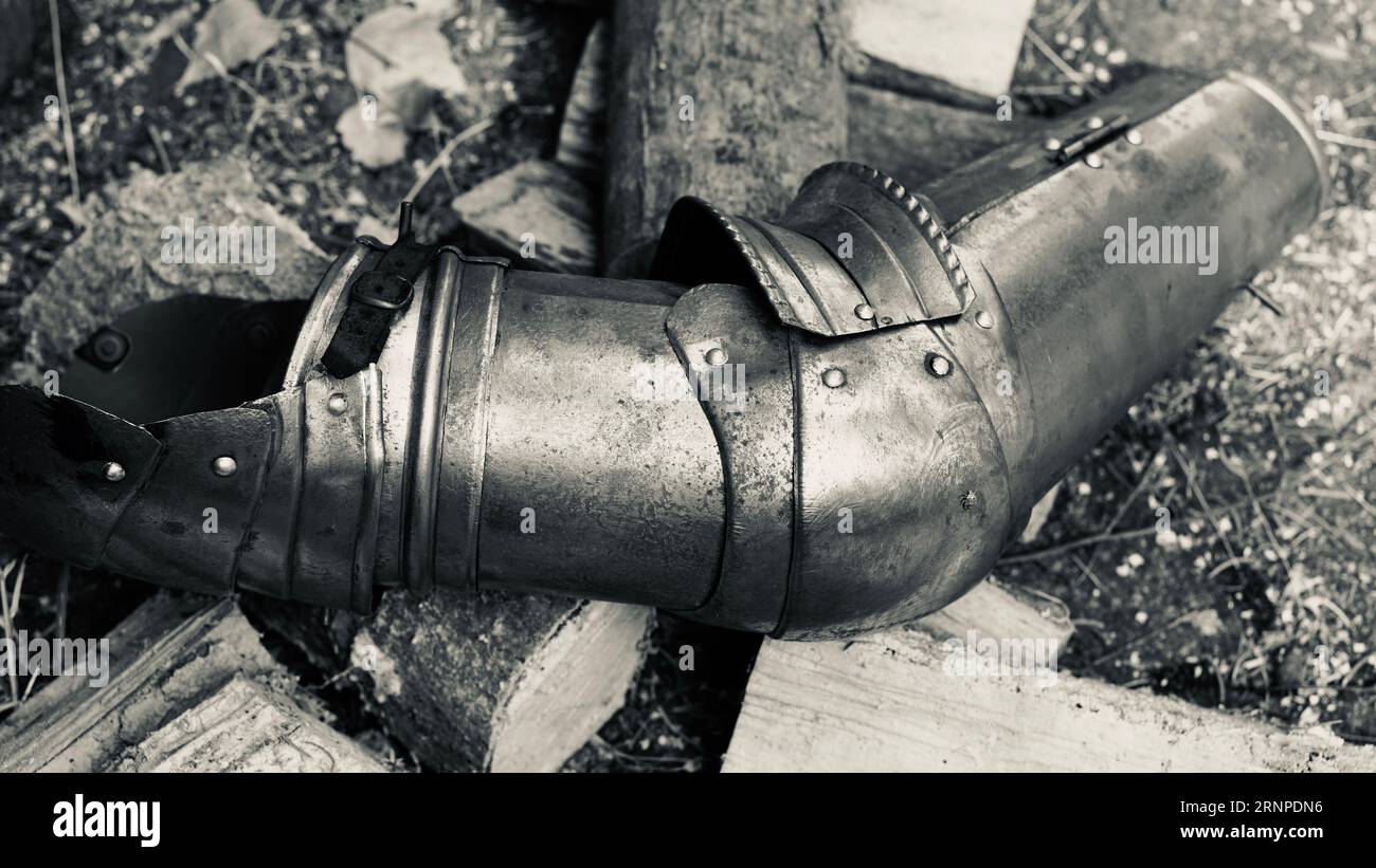 The arm of a knights armor on chops of firewood Stock Photo - Alamy