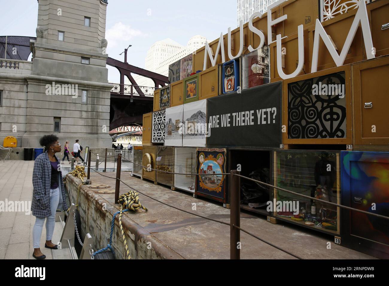 (170824) -- CHICAGO, Aug. 24, 2017 -- A visitor looks at art works of ...