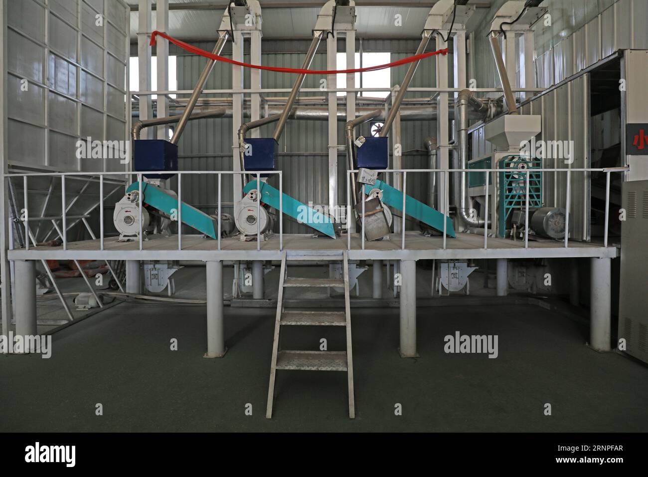 Advanced rice processing equipment in a grain processing plant, North ...
