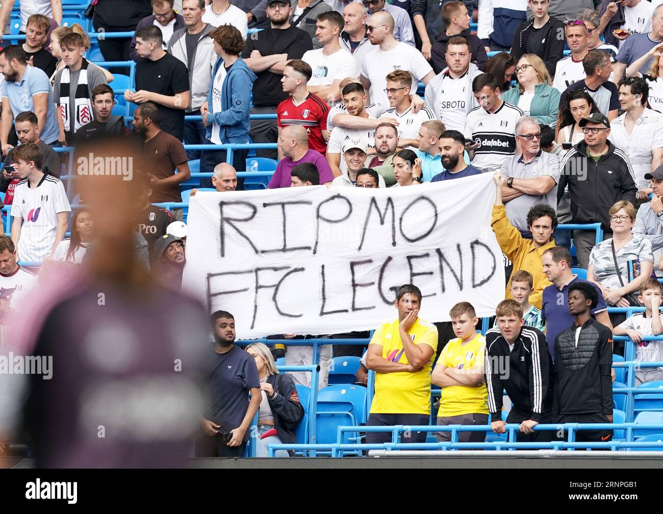 Fulham fans in the stands hold up a banner in memory of former Fulham ...