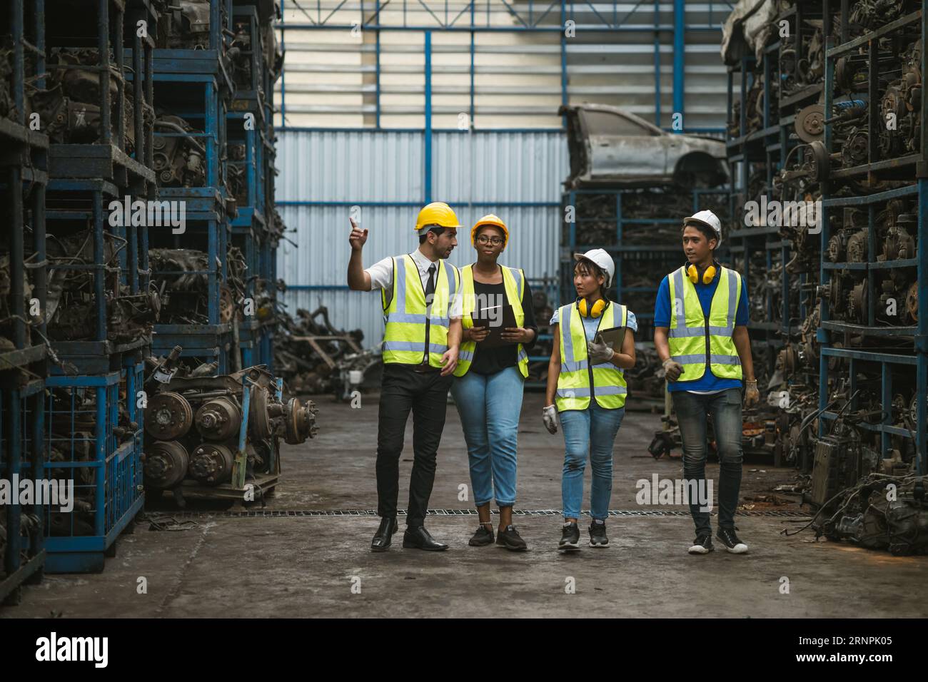 engineer worker team together happy working in old grunge garage used ...