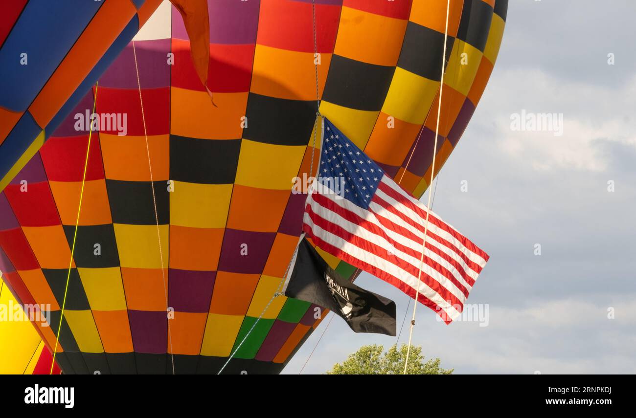 Closeup of hot air balloons flying the American flag and POW-MIA flag ...