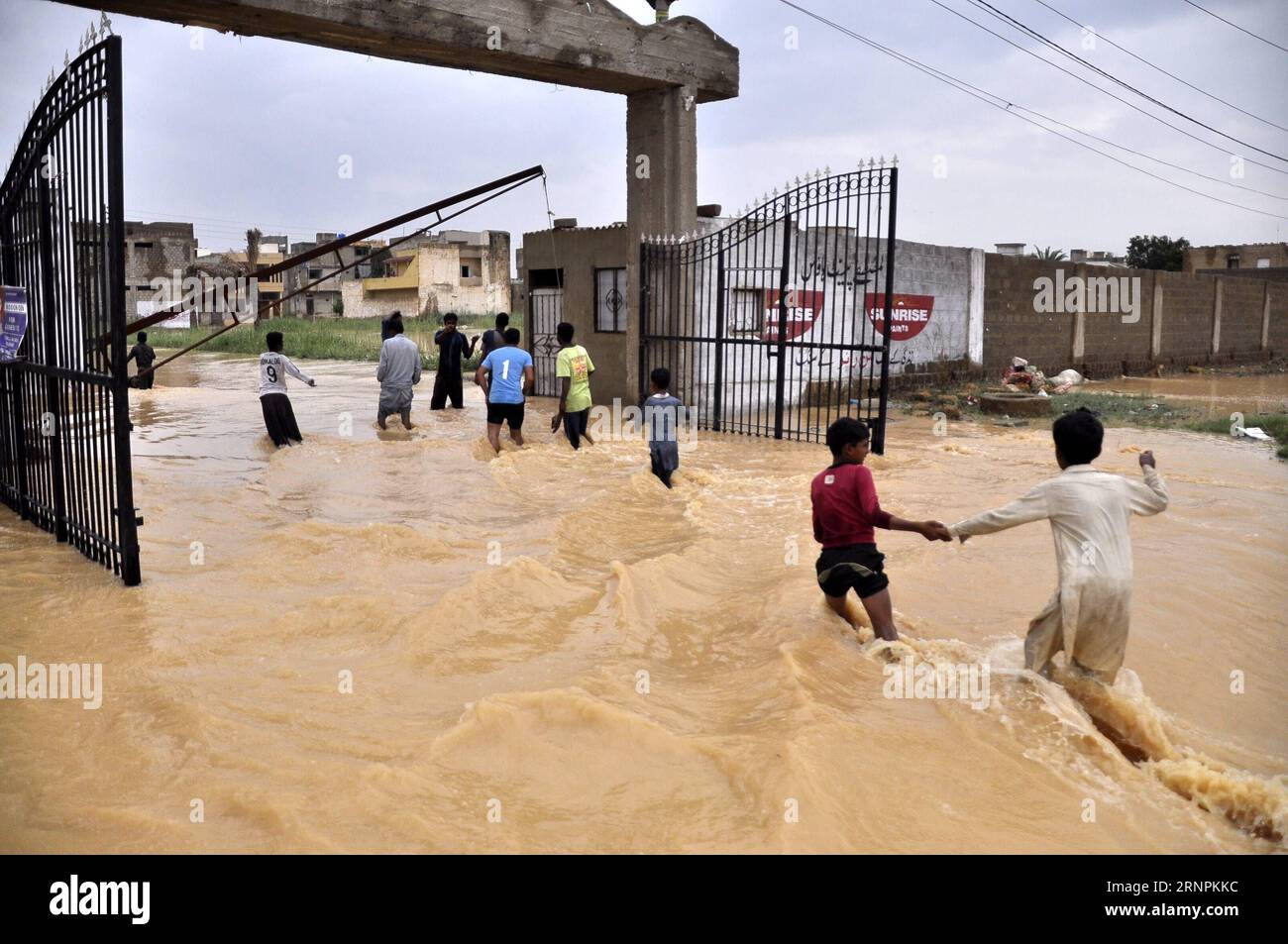 Children play in flood hi-res stock photography and images - Alamy