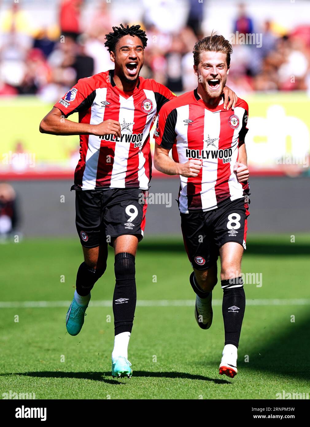 Brentford's Mathias Jensen (right) celebrates scoring their side's ...