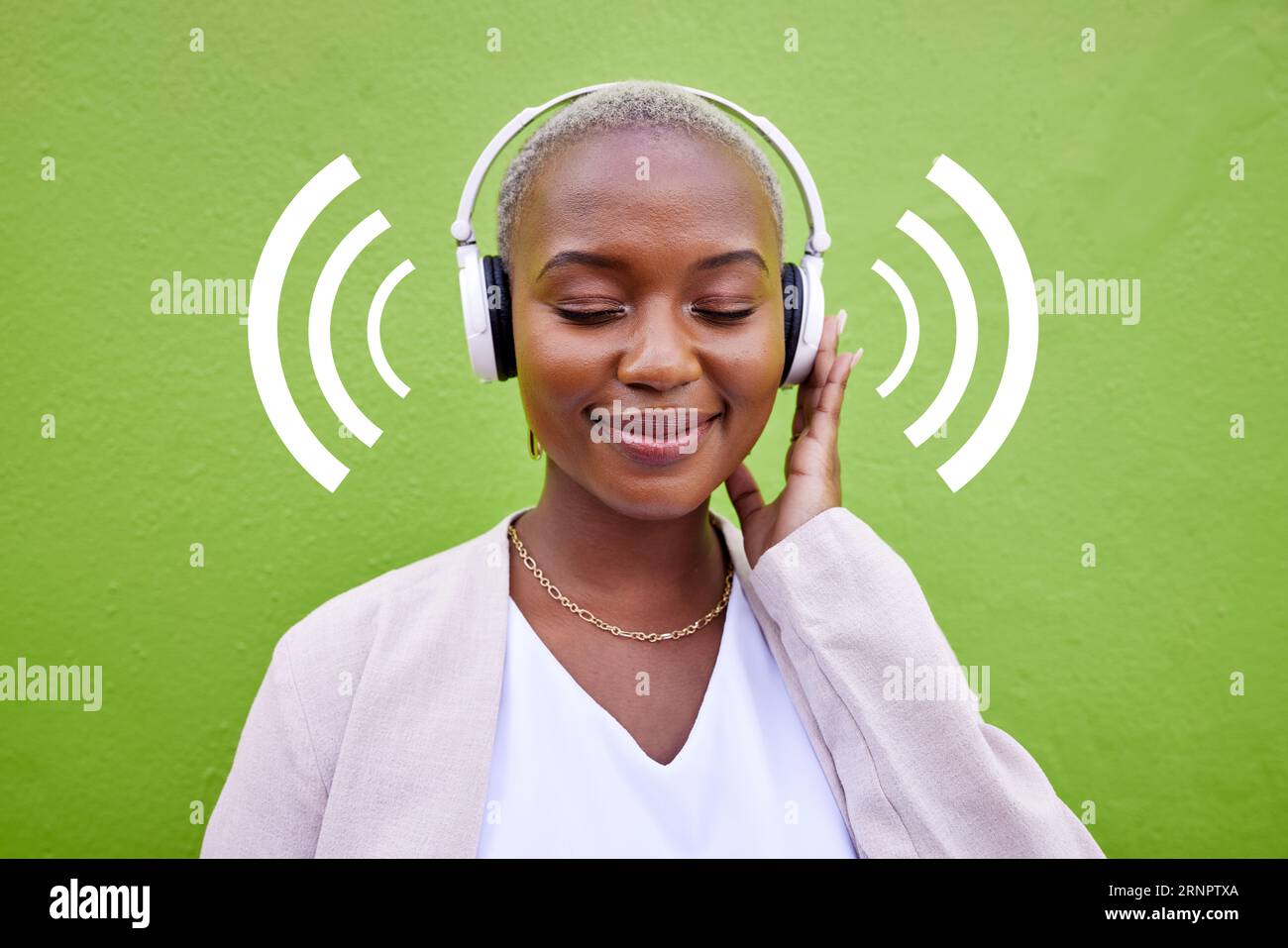 Music, headphones and happy black woman listening on green wall ...