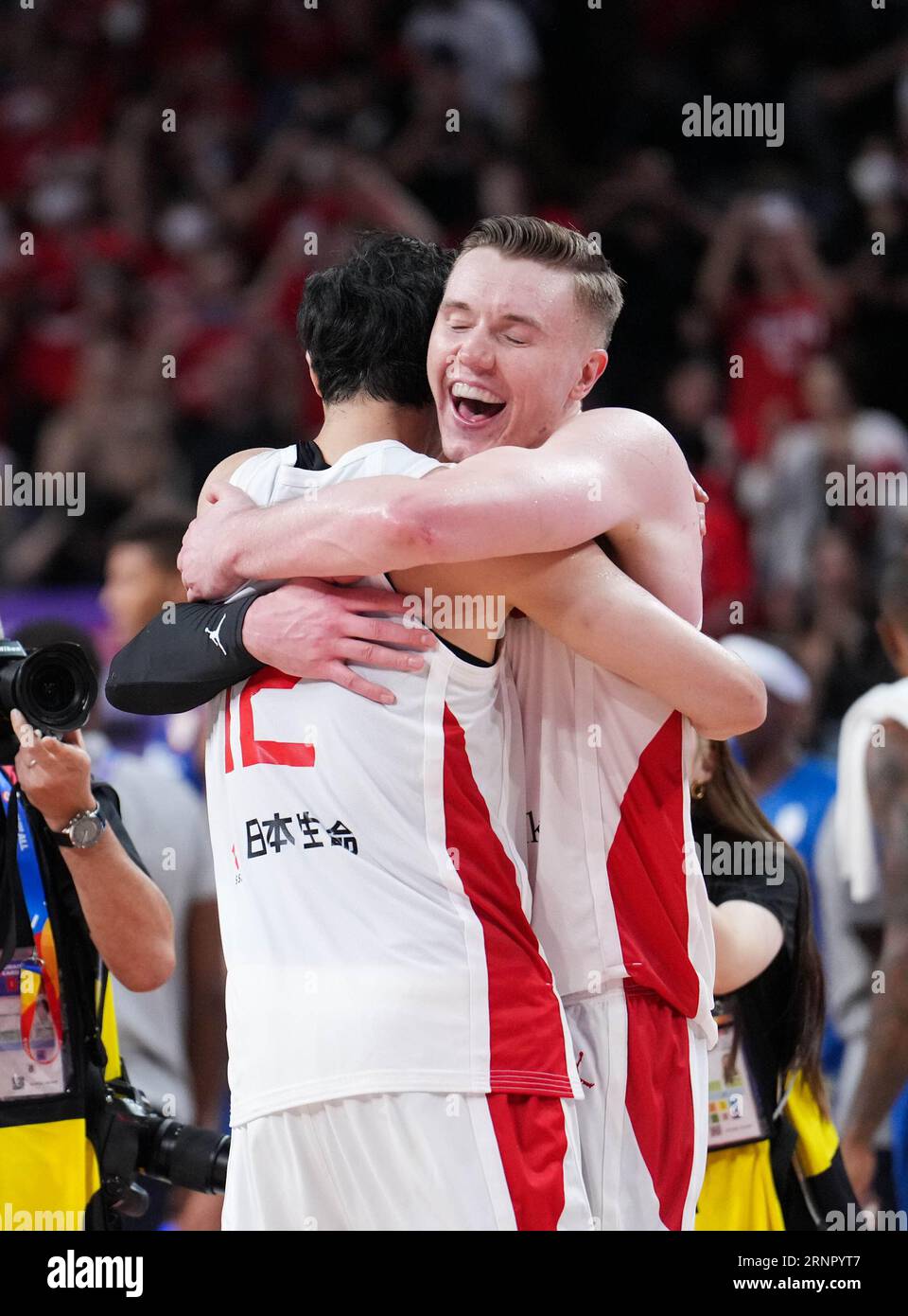 Okinawa, Japan. 2nd Sep, 2023. Joshua Hawkinson (R) of Japan hugs his ...