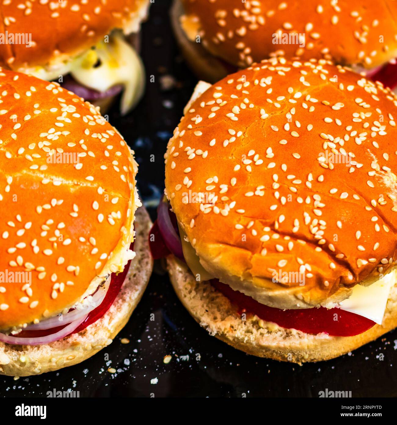 Tasty home made cheeseburger. Cheese burger with pickles, tomatoes ...