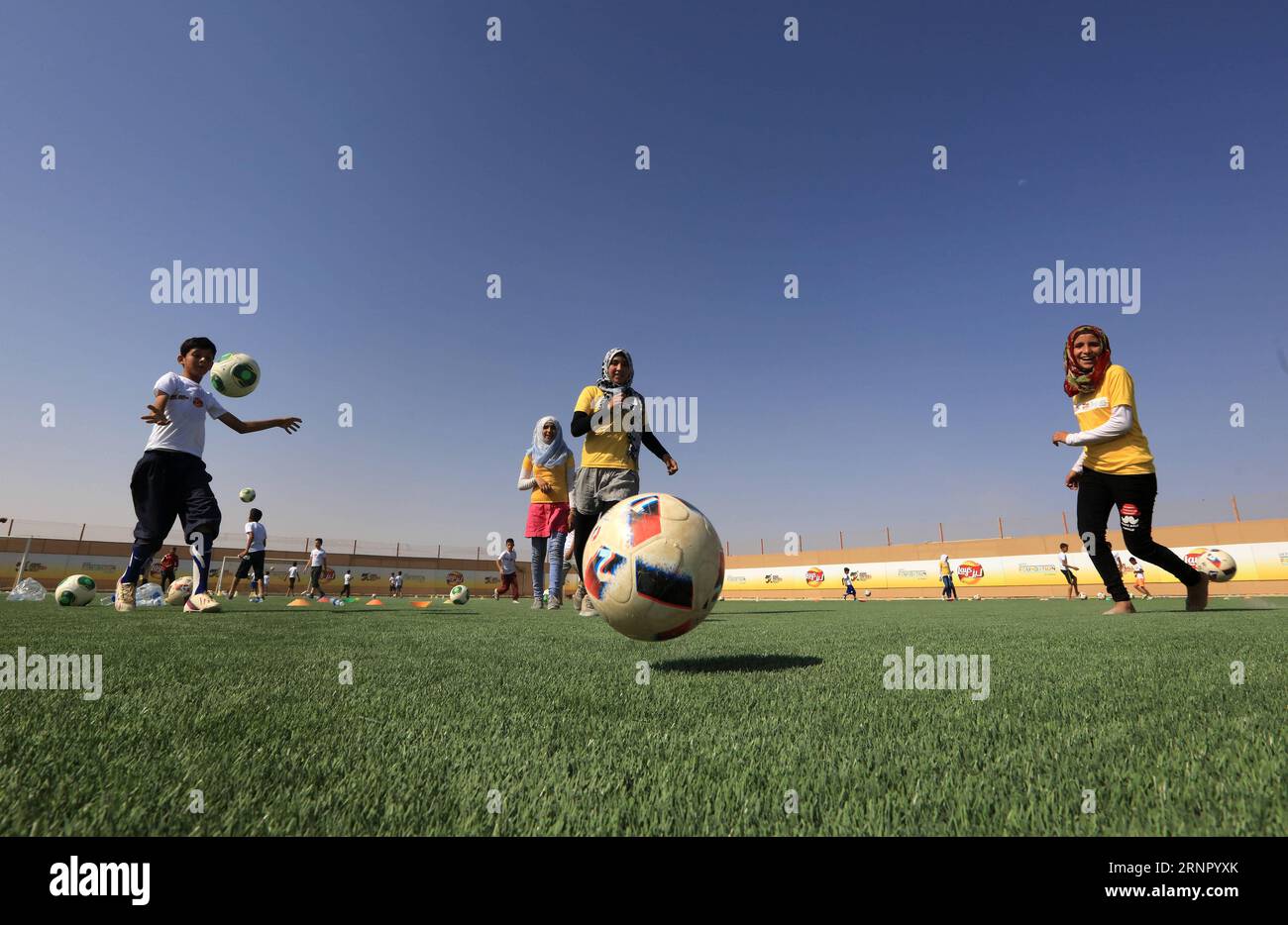 Refugee camp jordan children play hi-res stock photography and images ...