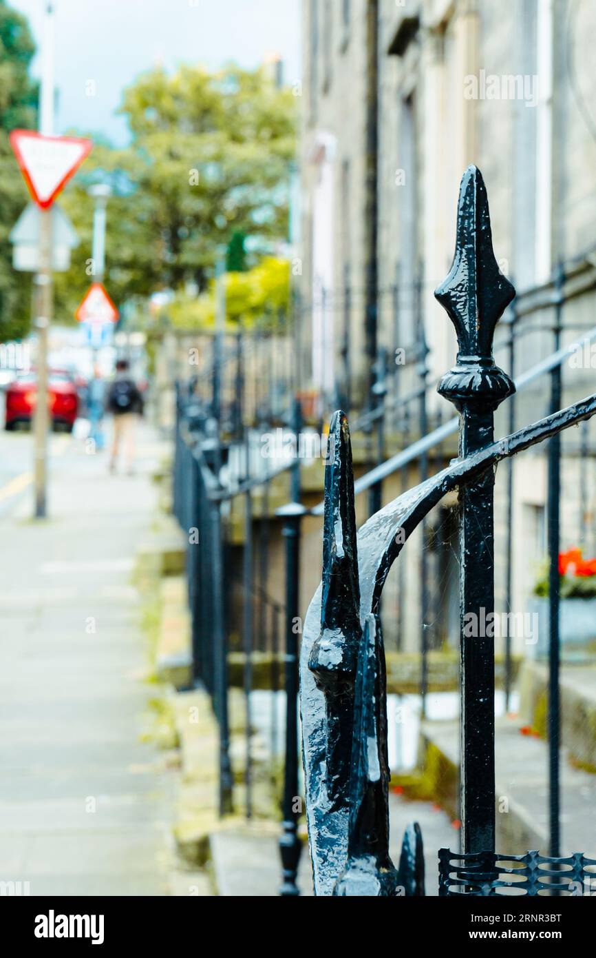Detail of a street in downtown Edinburgh. Selective focus on a wrought ...