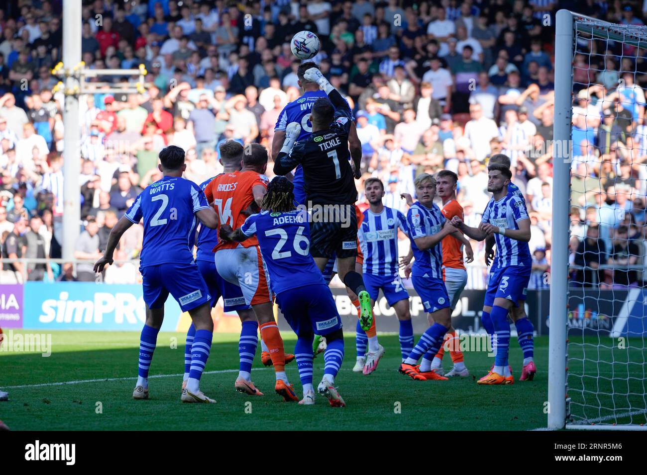 Blackpool, UK. 31st Aug, 2023. Sam Tickle #1 of Wigan Athletic punches ...