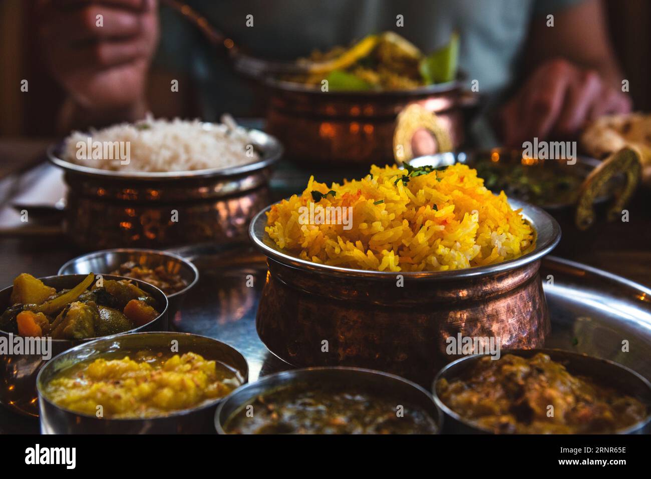 Indian family eating rice hi-res stock photography and images - Alamy