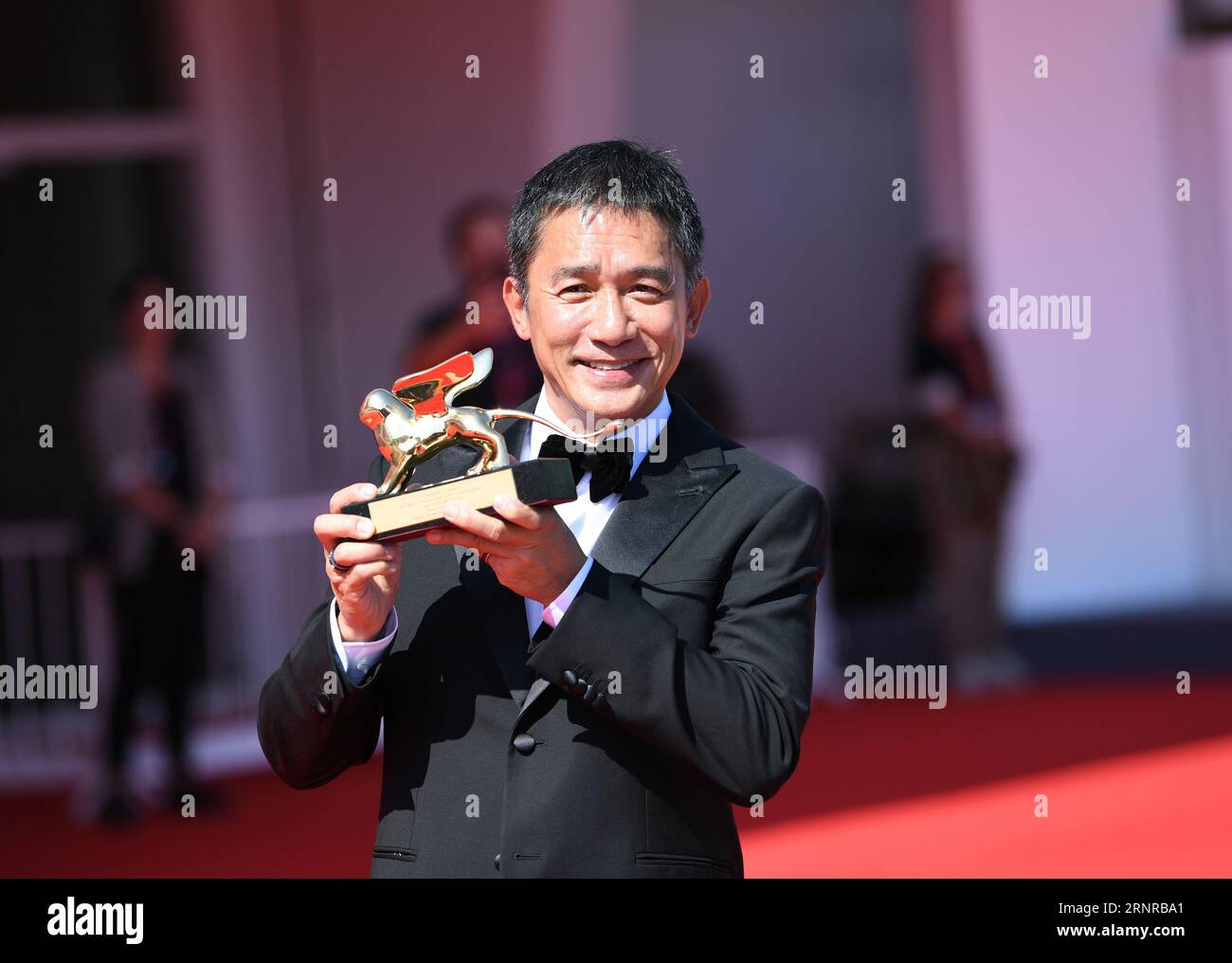 Venice, Italy. 2nd Sep, 2023. Actor Tony Leung Chiu-Wai poses with his ...