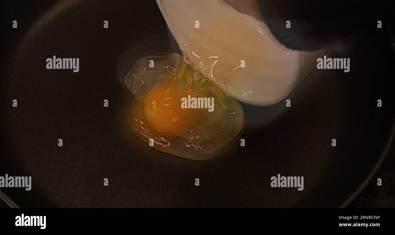 Egg cooked in a pan Stock Photo - Alamy