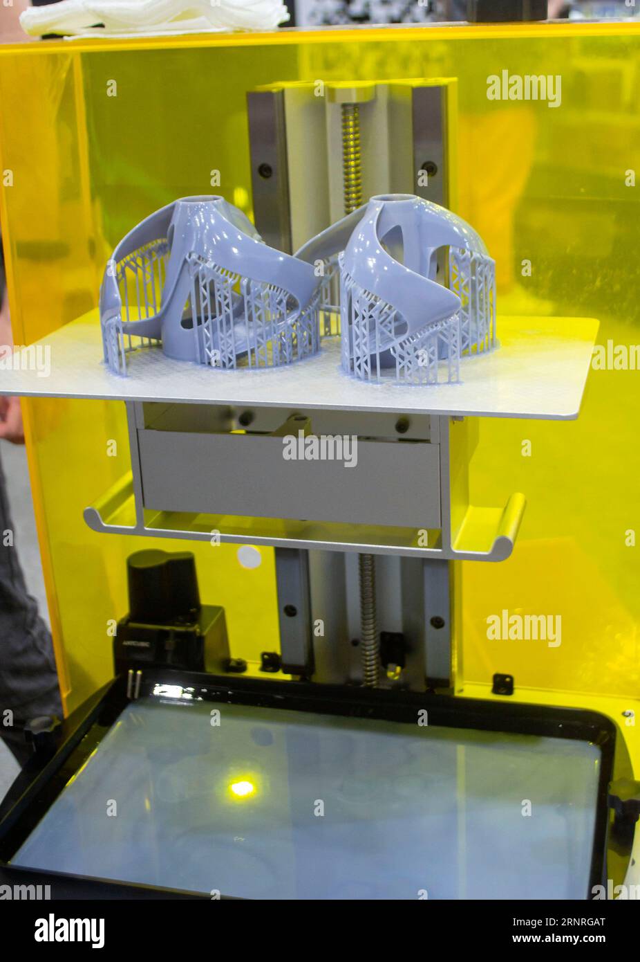 Printed models on 3D printer close-up. Objects printed on photopolymer ...
