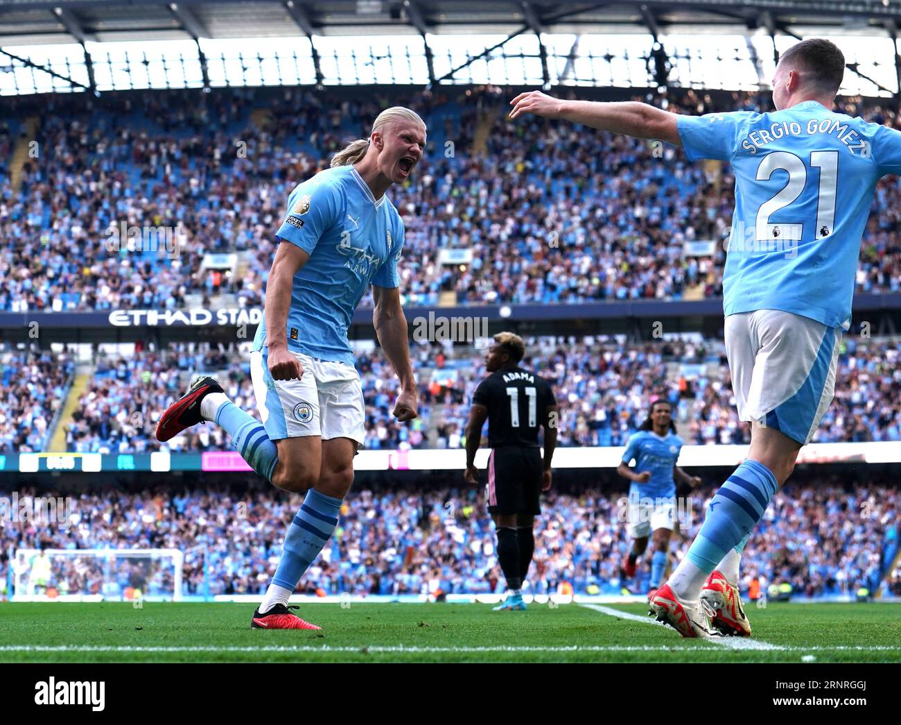 Manchester City's Erling Haaland (left) celebrates scoring their side's ...