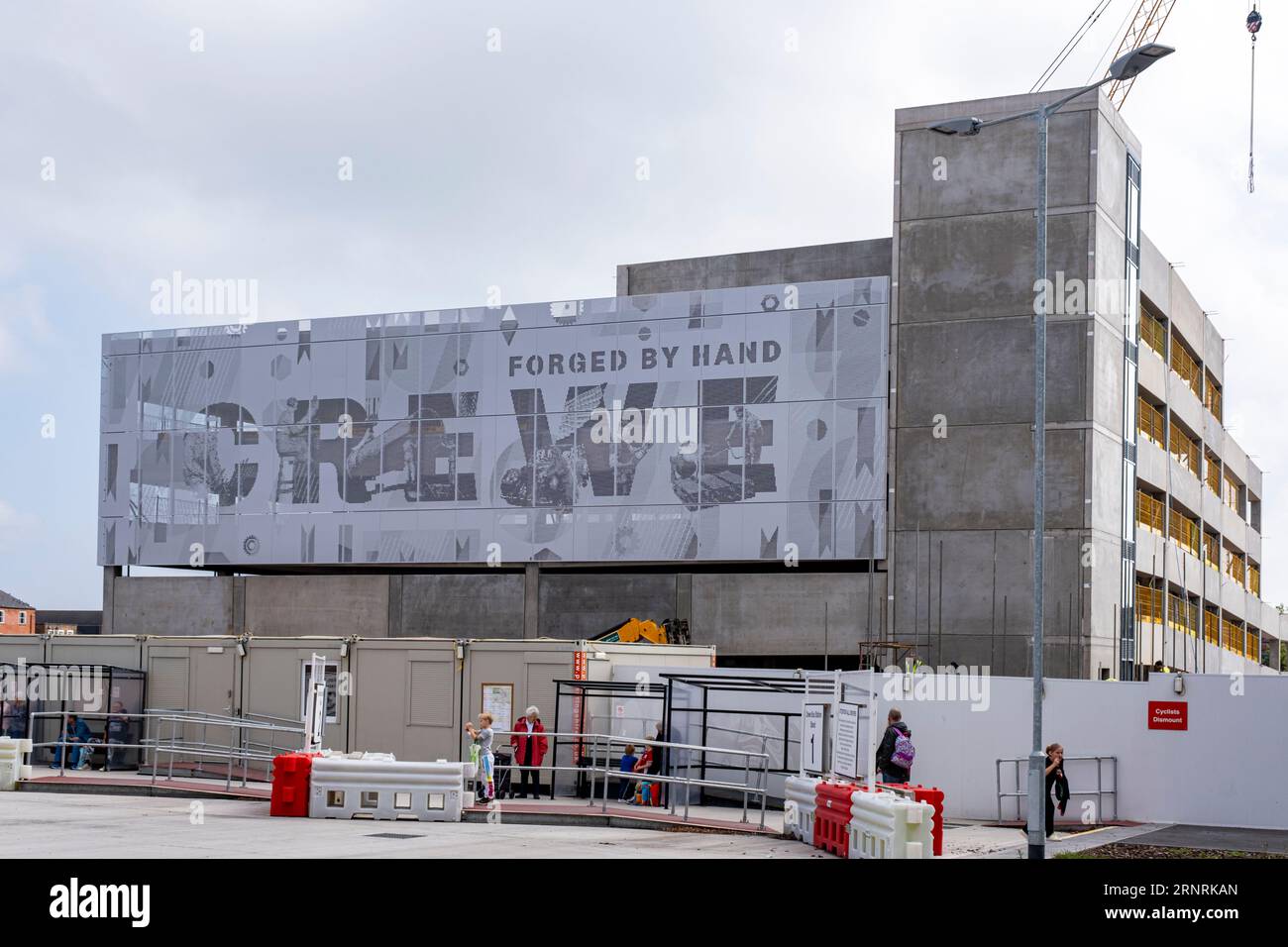 Crewe forged by hand, banner on multi storey car park, under ...