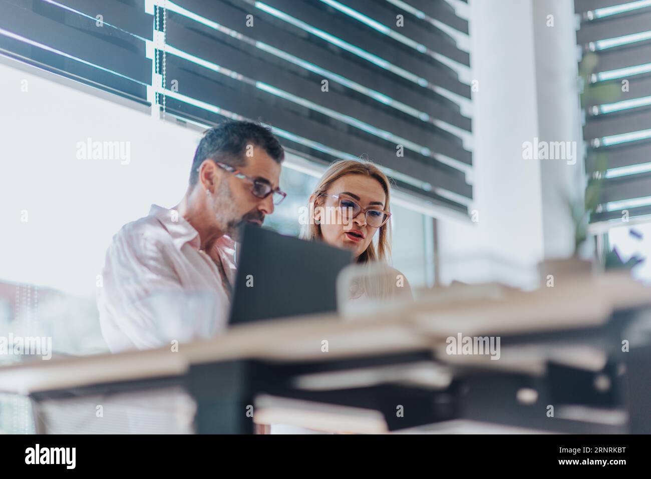 Diverse business team in modern office, analyzing data, creating ...