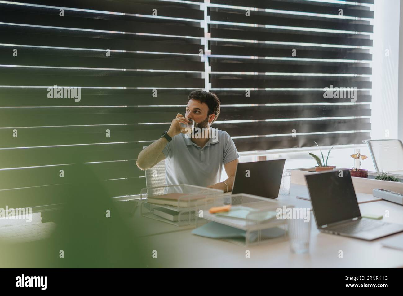 Good looking, successful businessman carefully listening to his ...