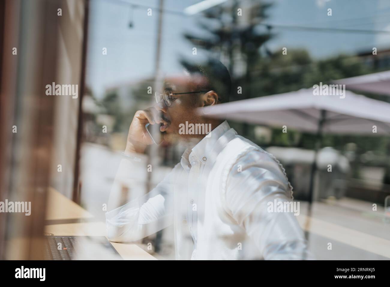 A shot through window of successful black male business person ...