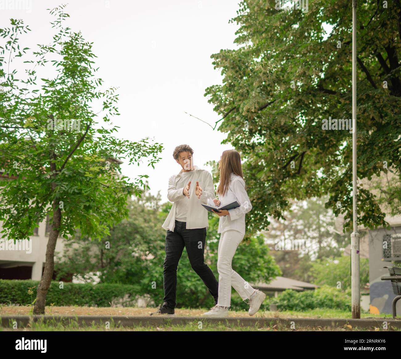 Two high school students walking outside hi-res stock photography and ...