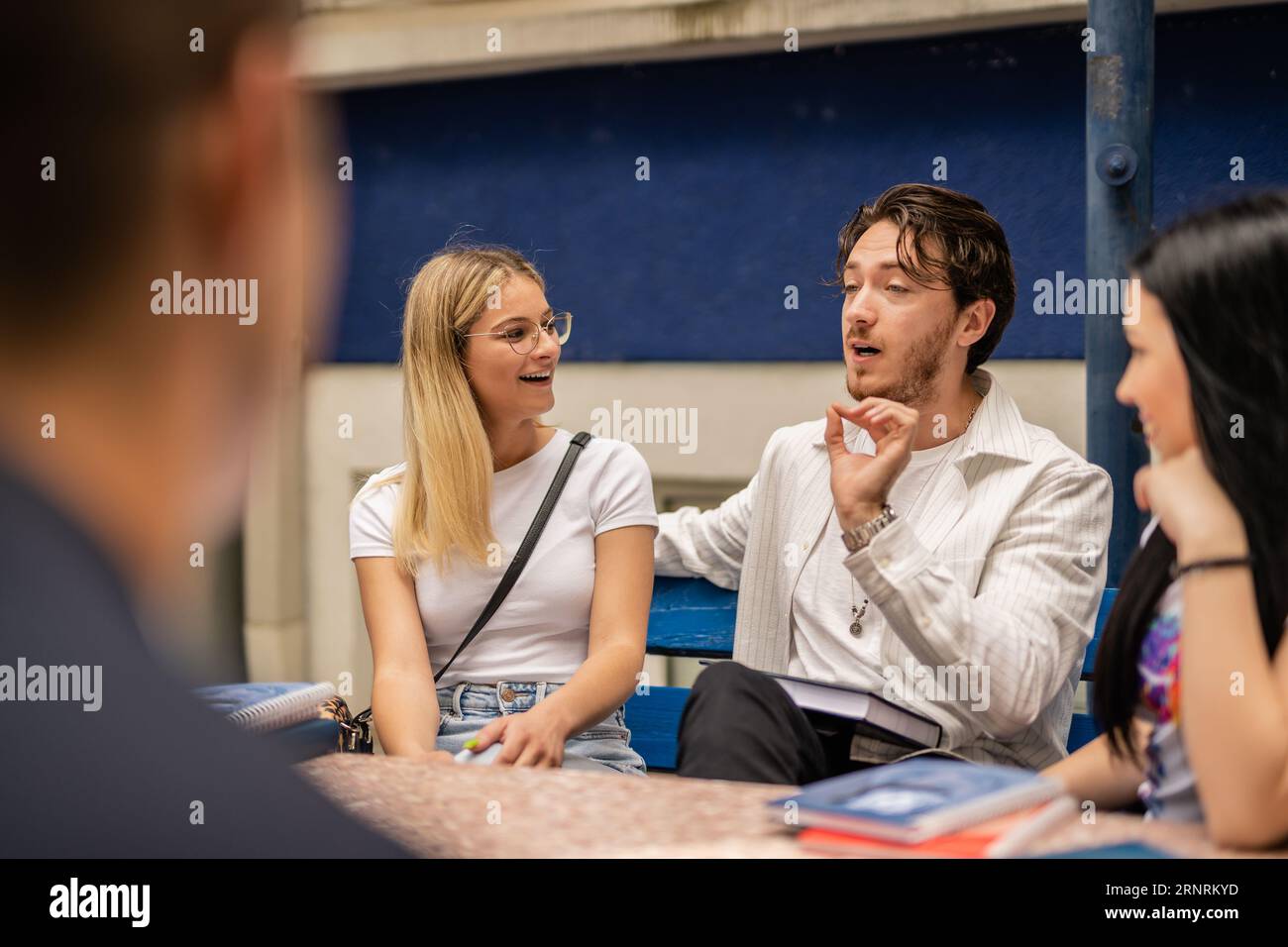 There happy, positive students having fun conversation and smiling ...