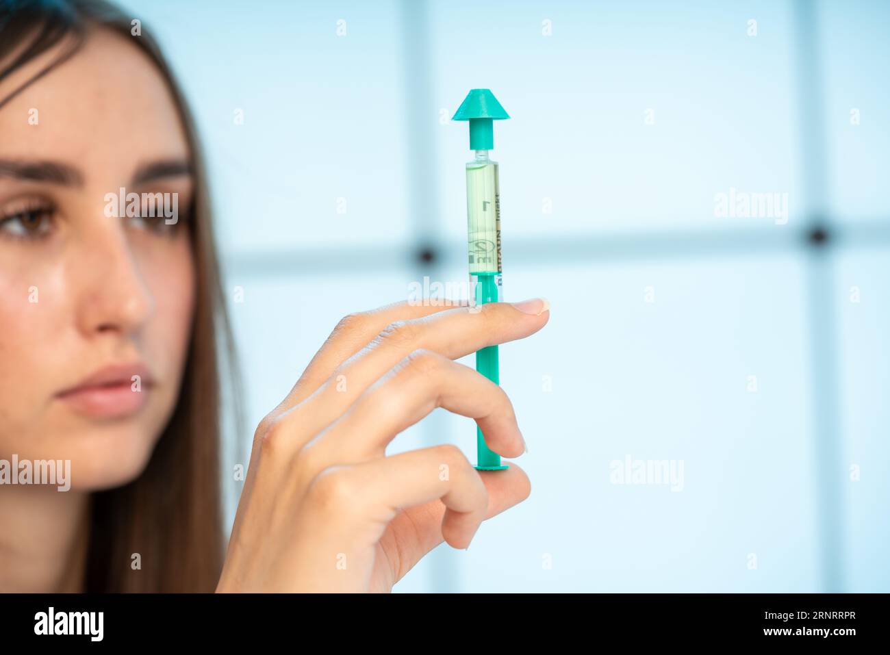 girl holding a syringe with intranasal medicine in her hand Stock Photo ...
