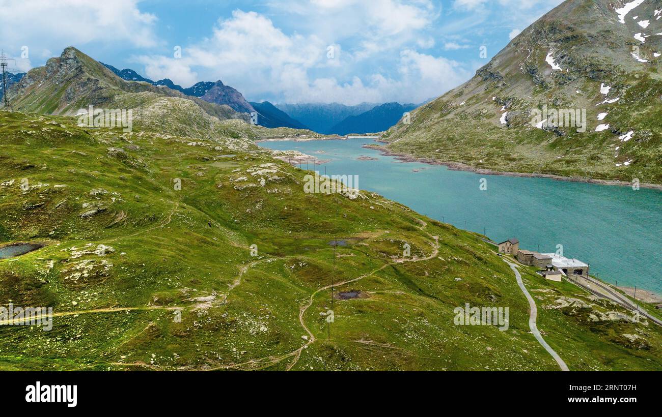 Aerial view Bird's eye view of mountain lake at mountain pass Alpine ... Aerial view Bird's eye view of mountain lake at mountain pass Alpine ...