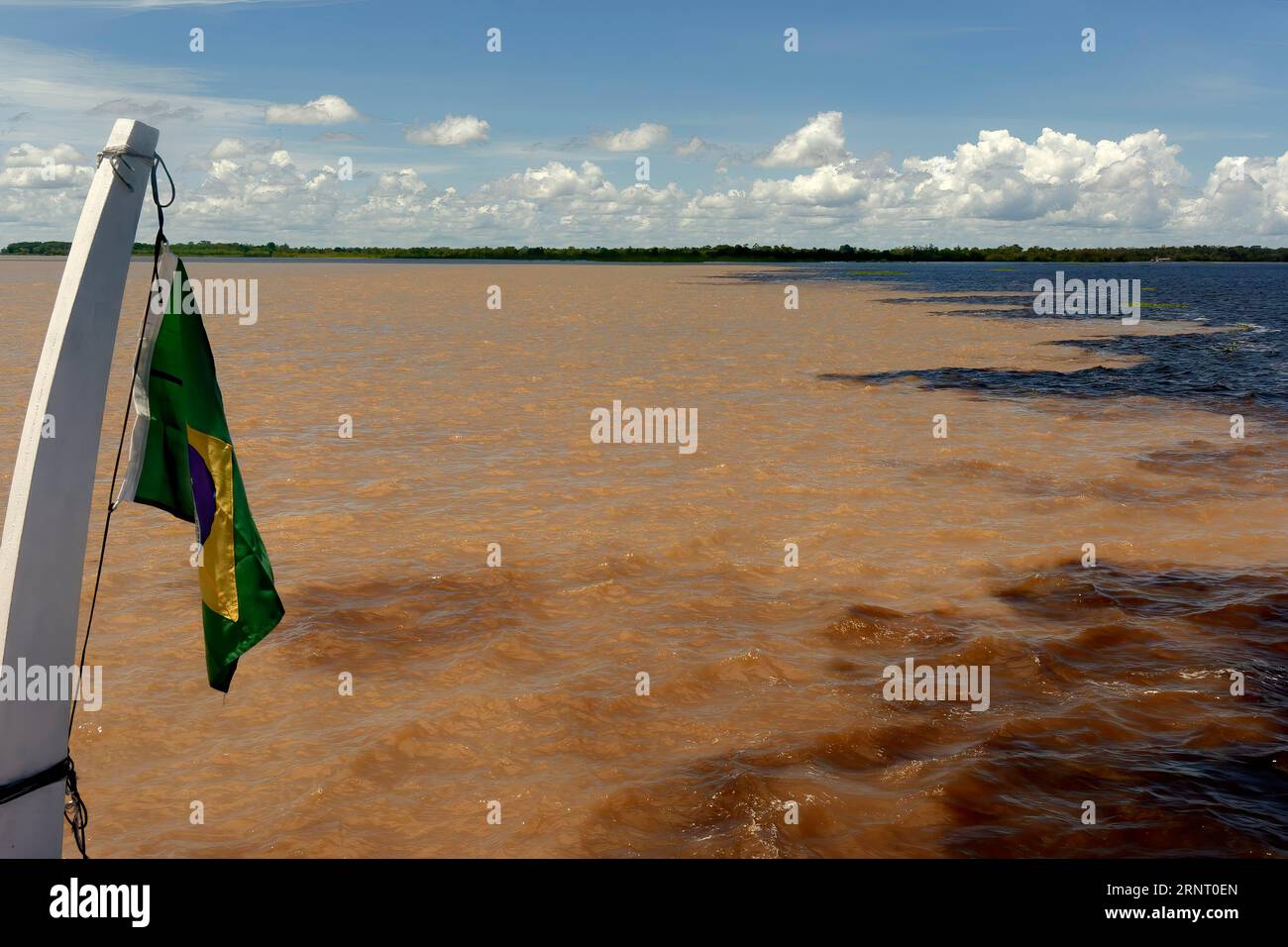 Confluence of the Rio Negro and Solimoes forming the Amazon river ...