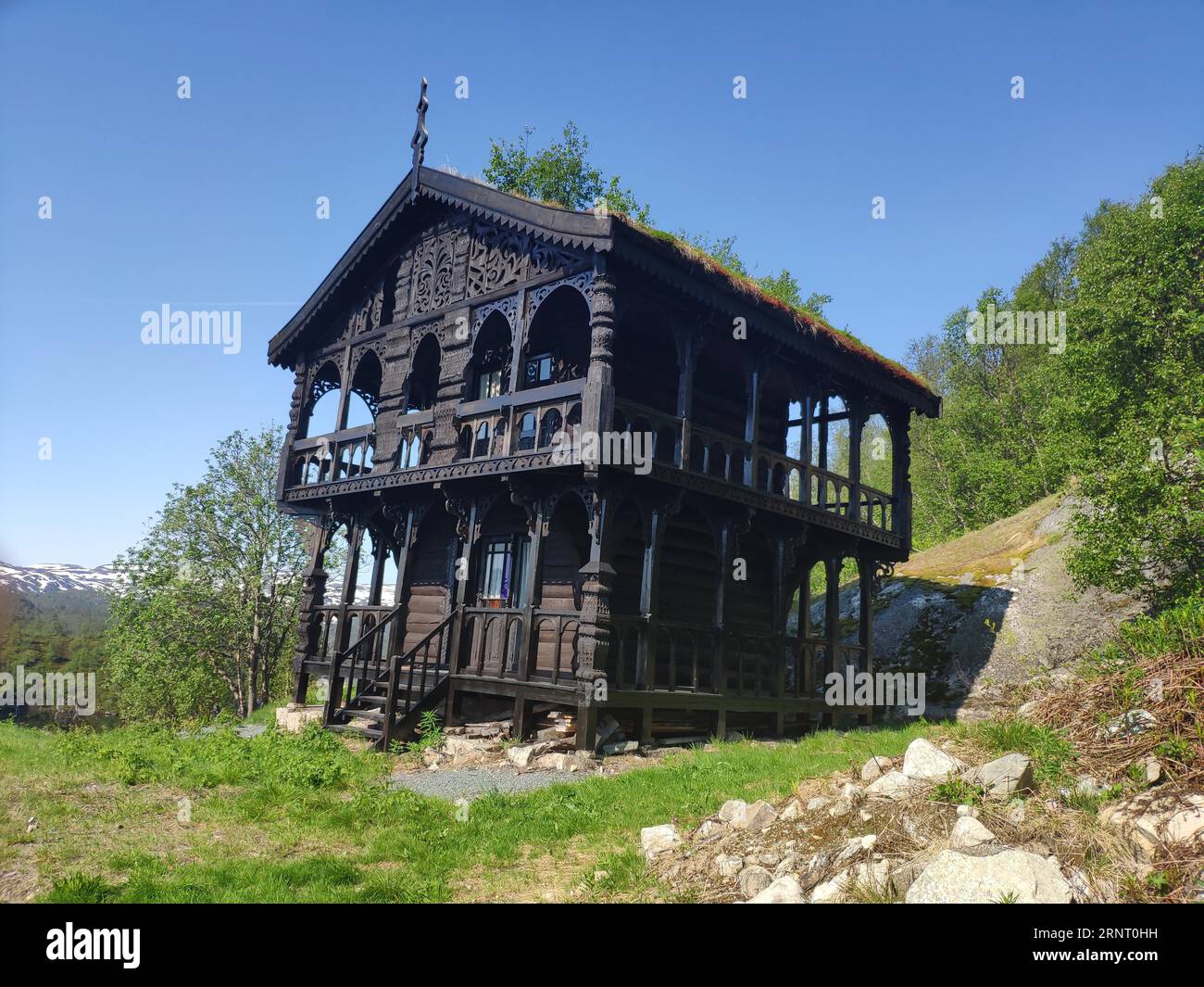 Old granary, Botn, Telemark, Norway. Meadow, grass, blue sky, village ...
