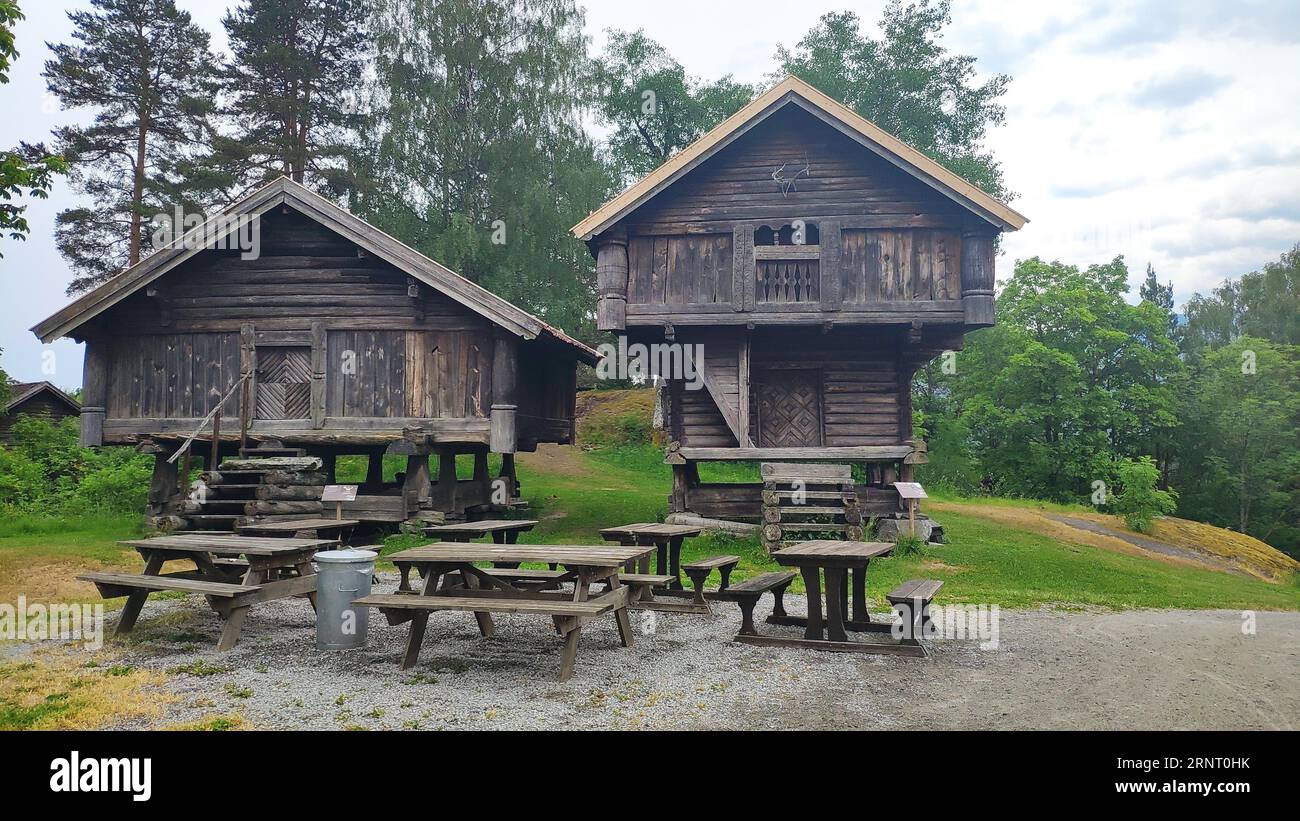 Historical building, Telemark, Norway. Meadow, grass, blue sky, village ...