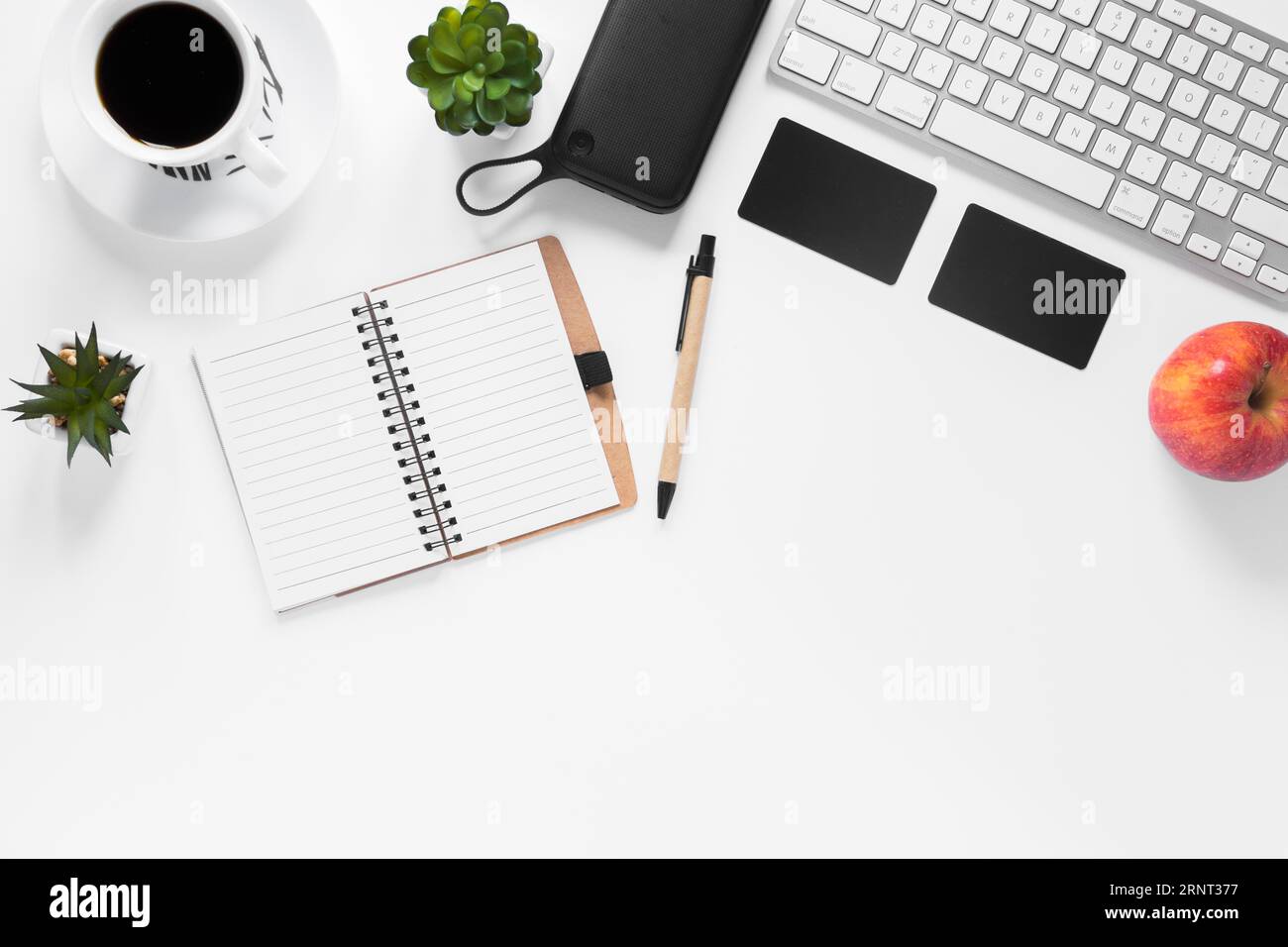 Coffee cup cactus plant card apple diary pen white backdrop Stock Photo ...